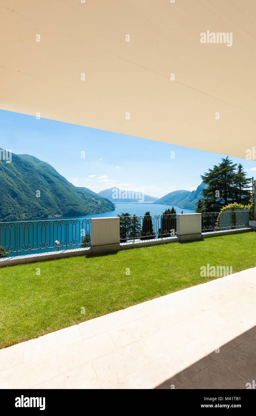 Interior apartment with garden, view from veranda Stock Photo - Alamy
