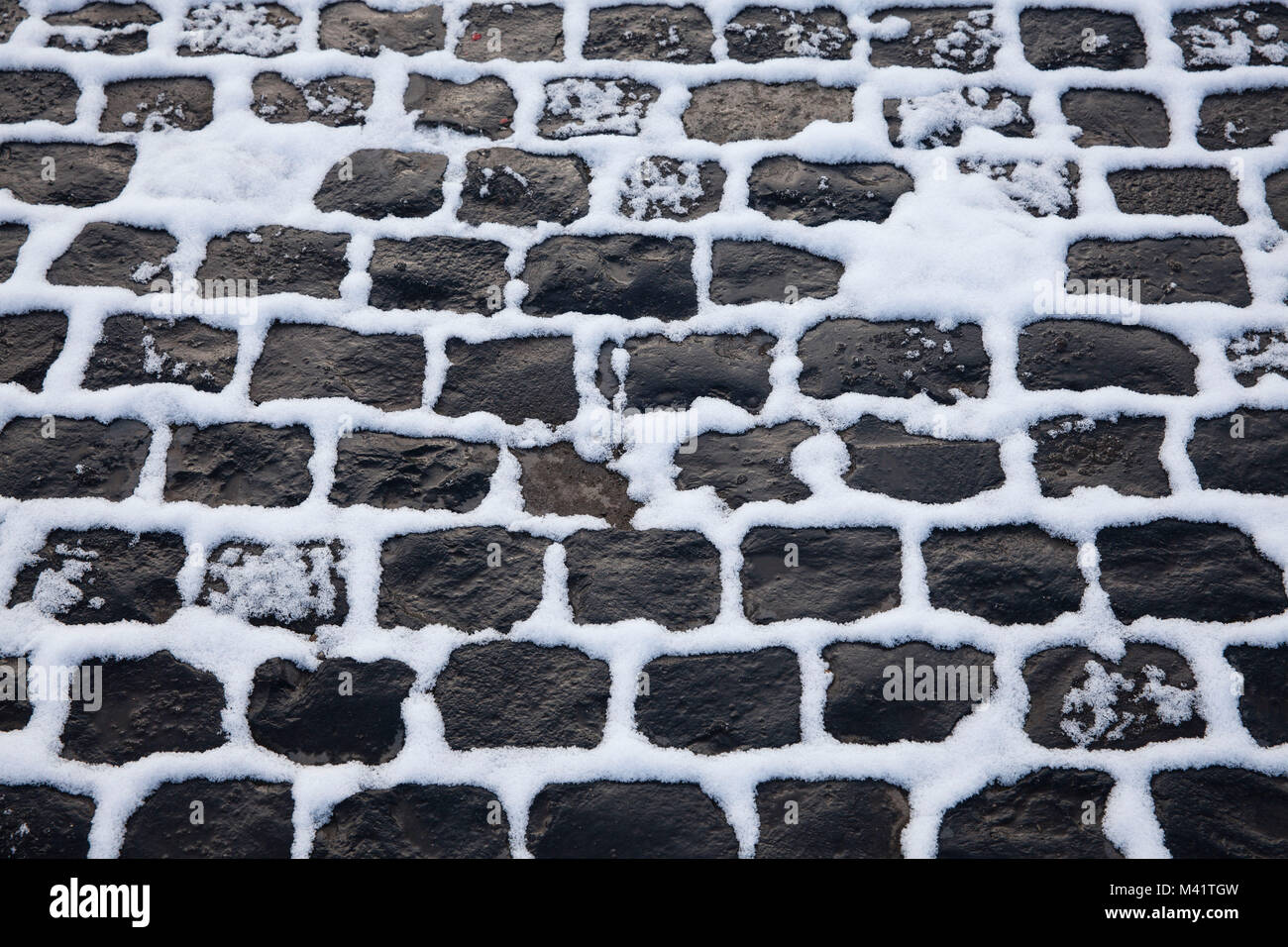 Europe, Germany, Cologne, snow on cobblestone. Europa, Deutschland ...
