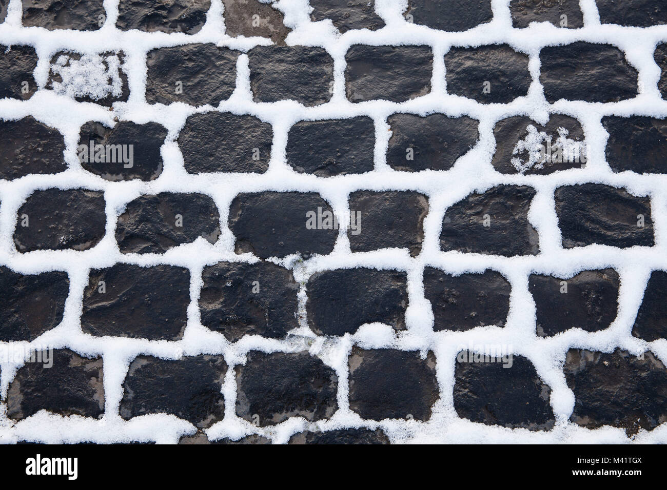 Europe, Germany, Cologne, snow on cobblestone. Europa, Deutschland ...