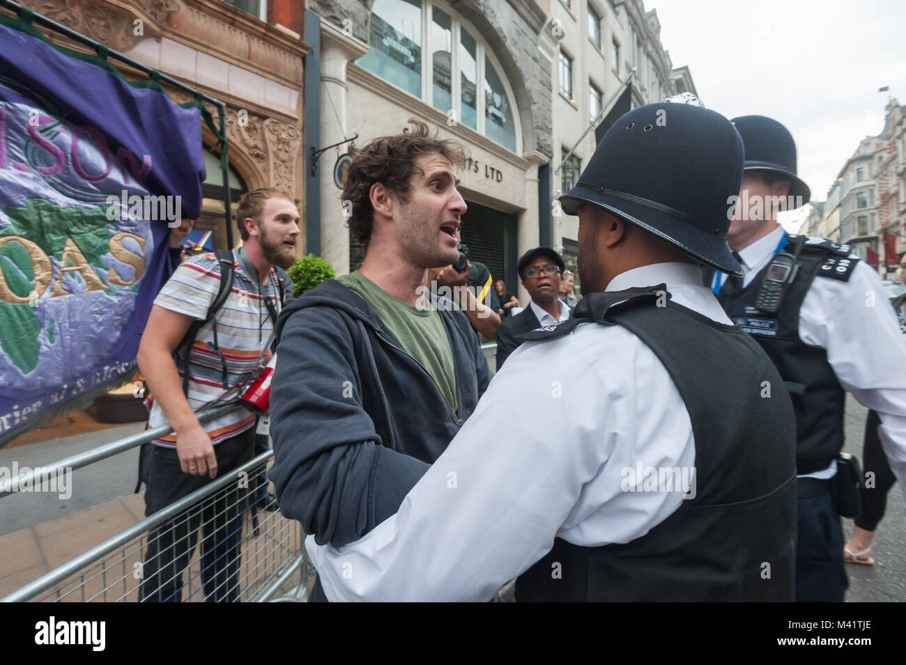 Scuffles and arguments continued for some minutes between protesters ...