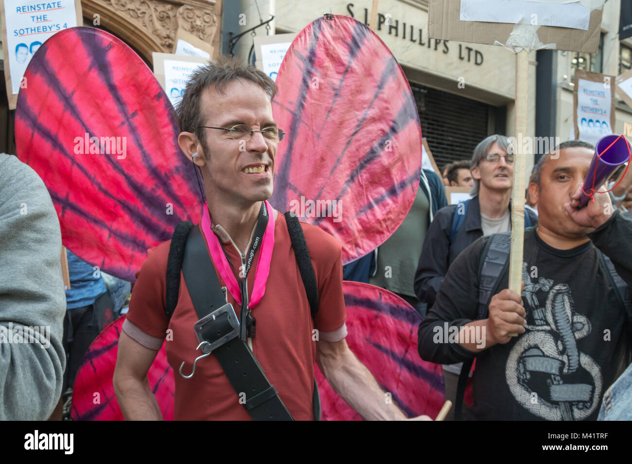 A drummer with wings at the protest at Sotheby's in Old Bond St calling ...