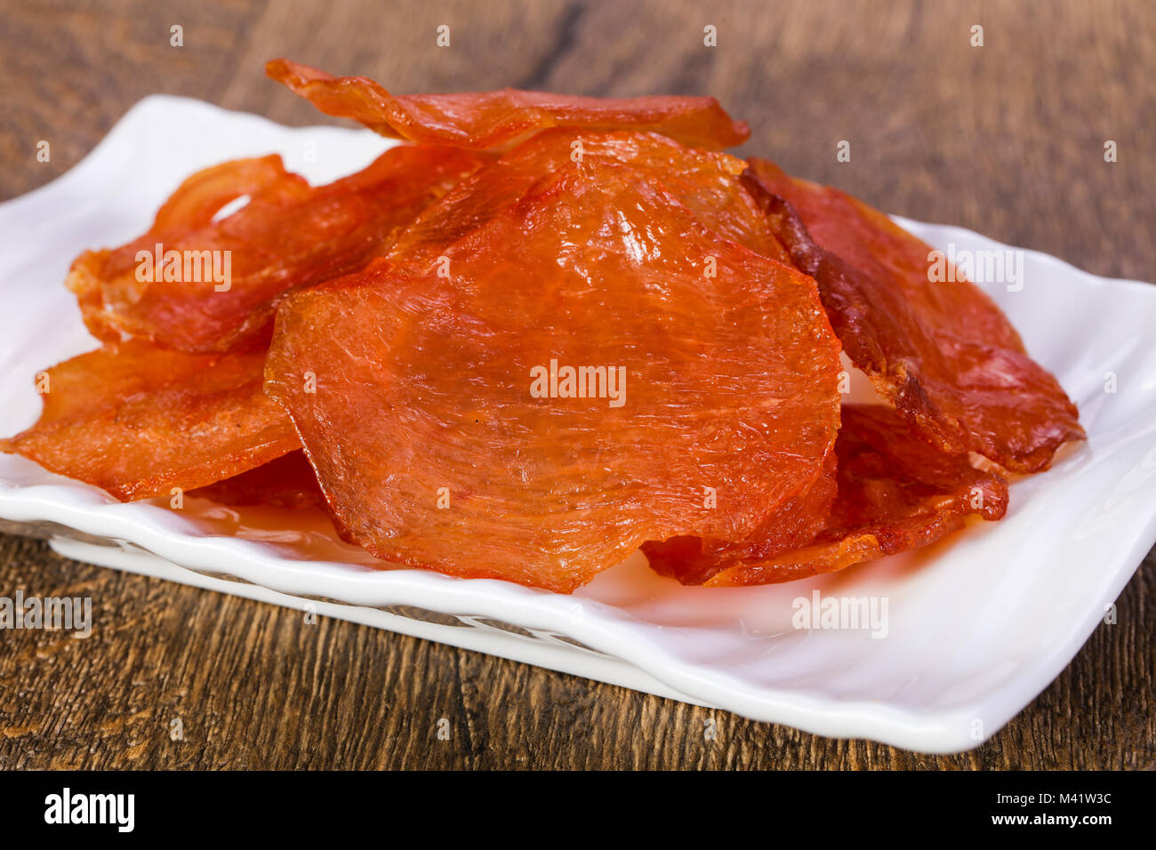 Dry chicken meat over wooden Stock Photo - Alamy