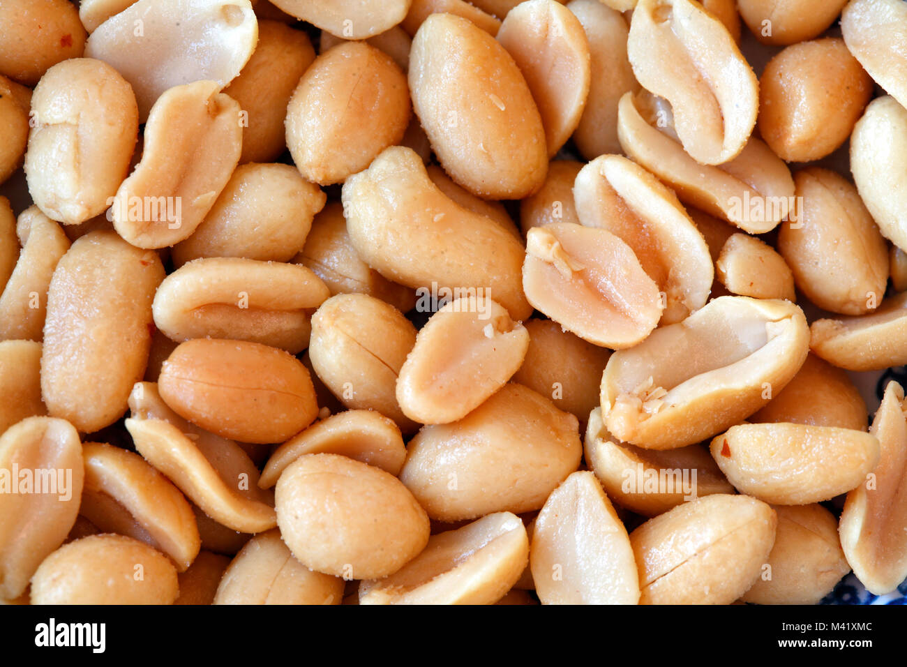 brown salted peanuts finger food Stock Photo - Alamy