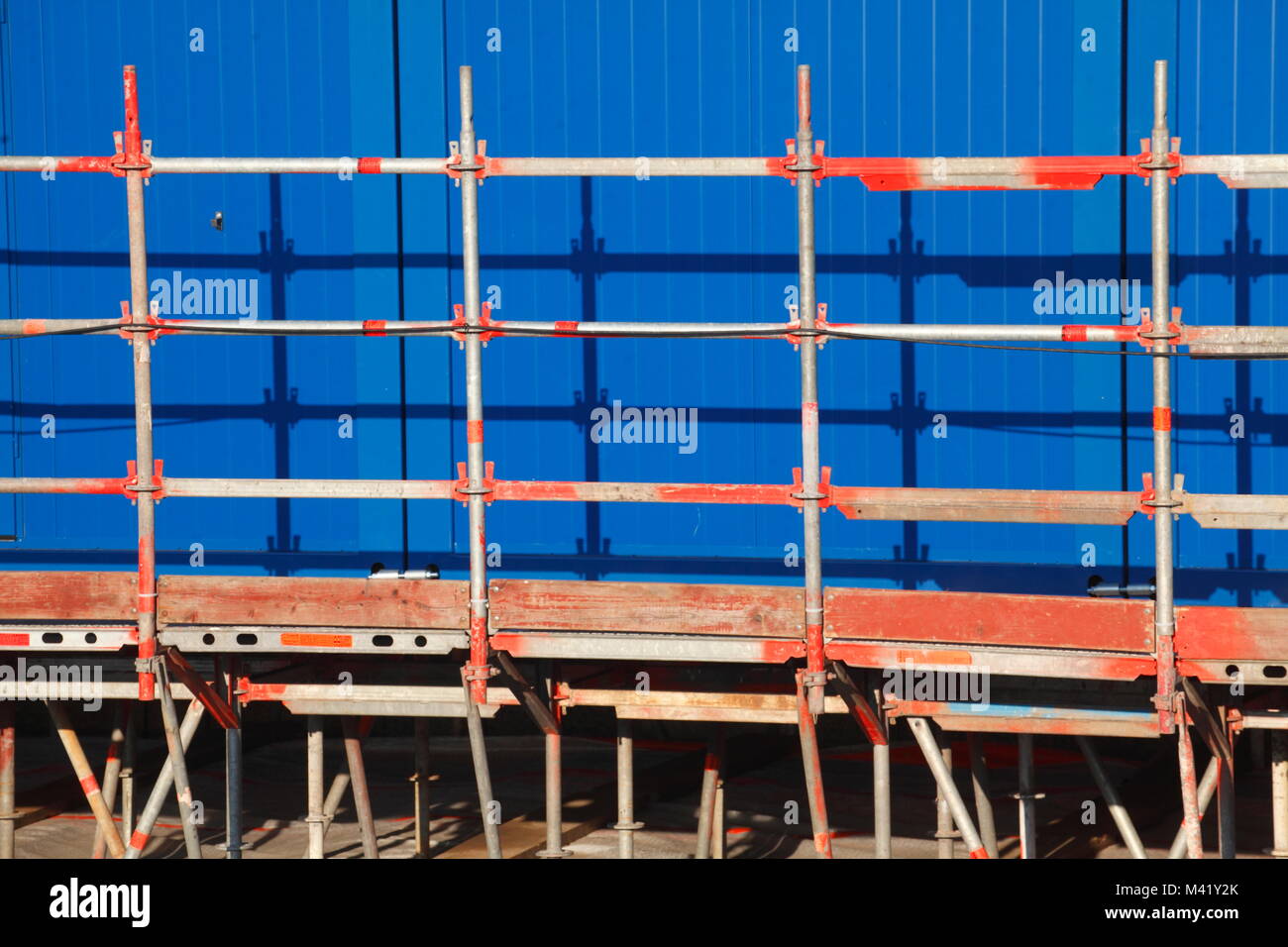 colorful scaffold on a construction site with blue background Stock ...