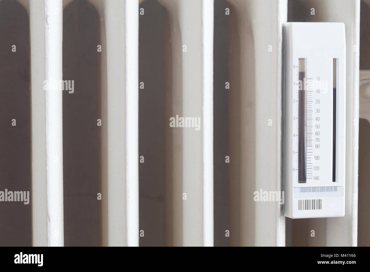 Old white heater from metal with heating counter Stock Photo - Alamy