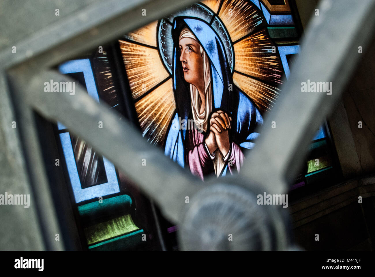 A stained glass window showing a female figure in the crypt of the ...