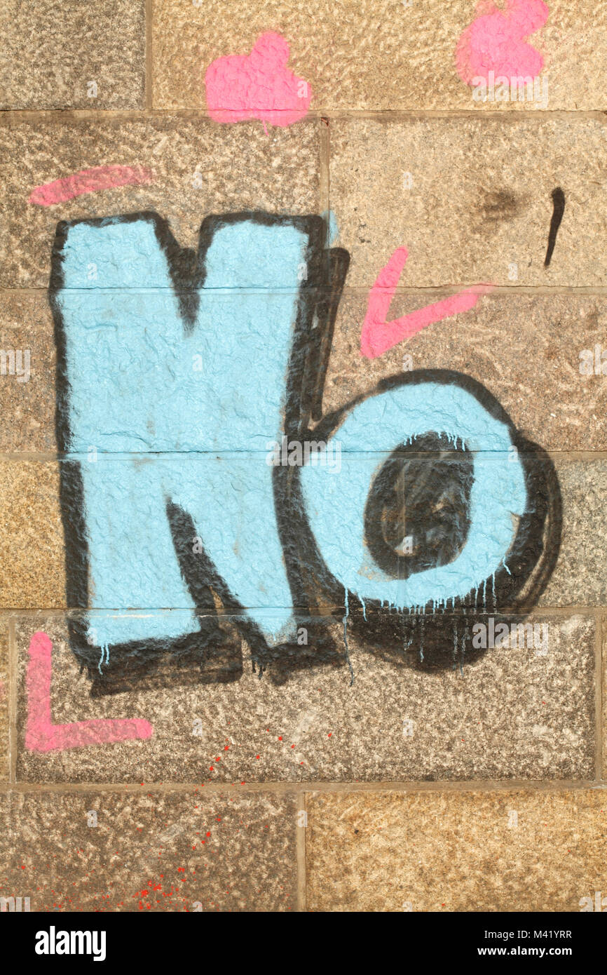 brown painted wall with blue Letters No Stock Photo - Alamy