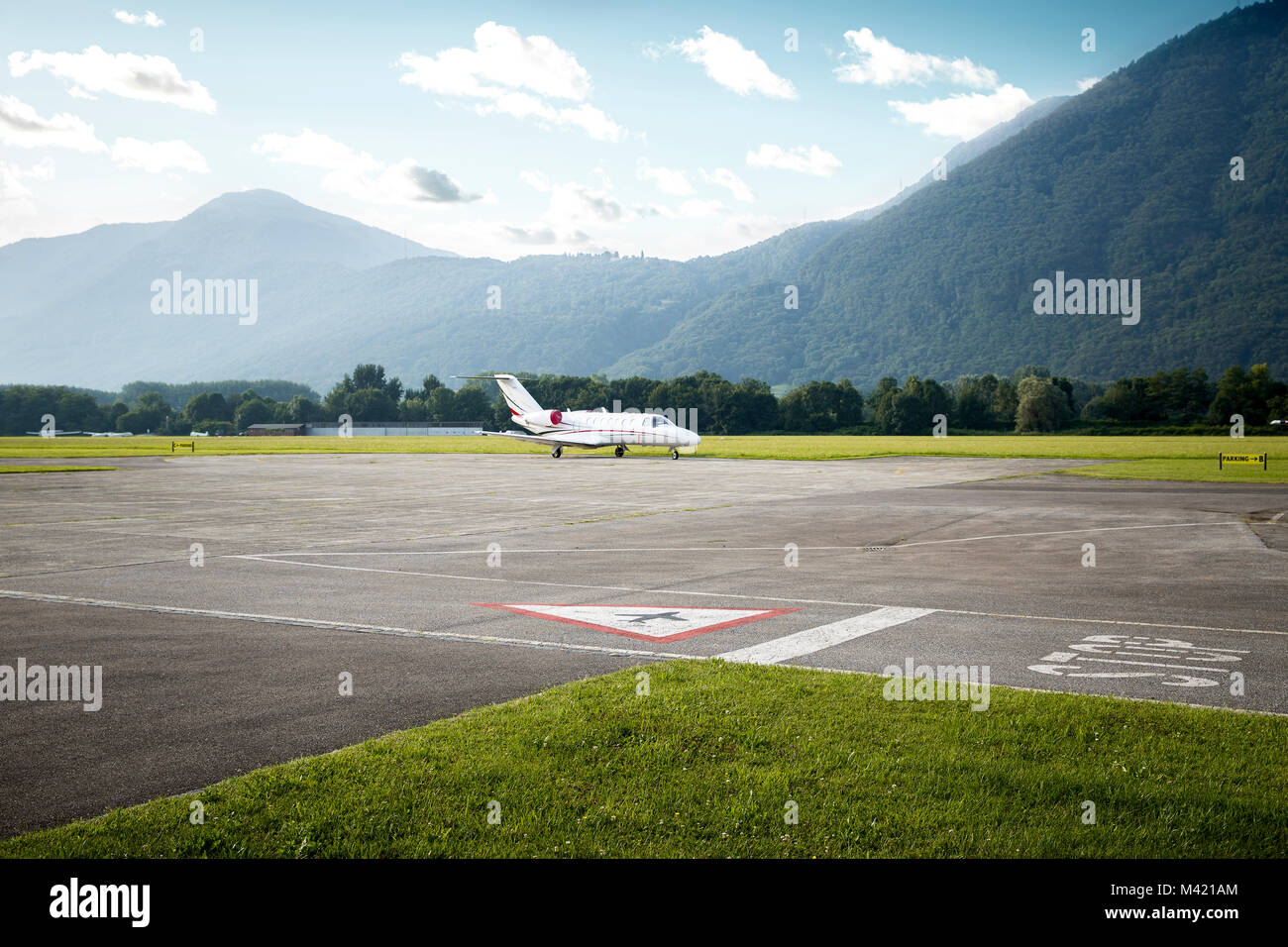 Private jet parked on the airport Stock Photo - Alamy
