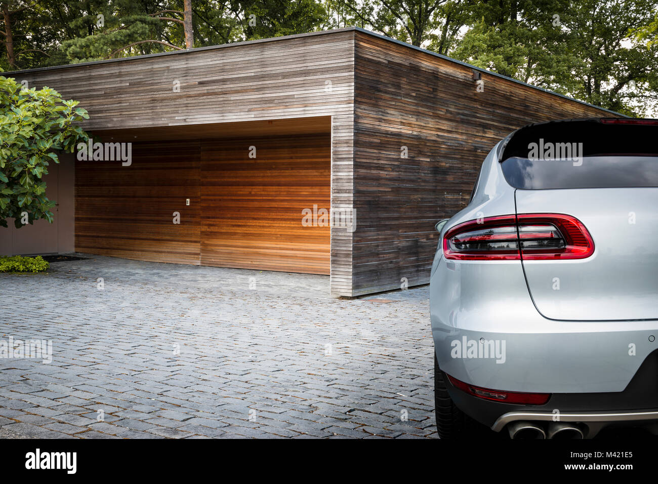 Nice sport SUV car in front of a garage on the countryside Stock Photo ...