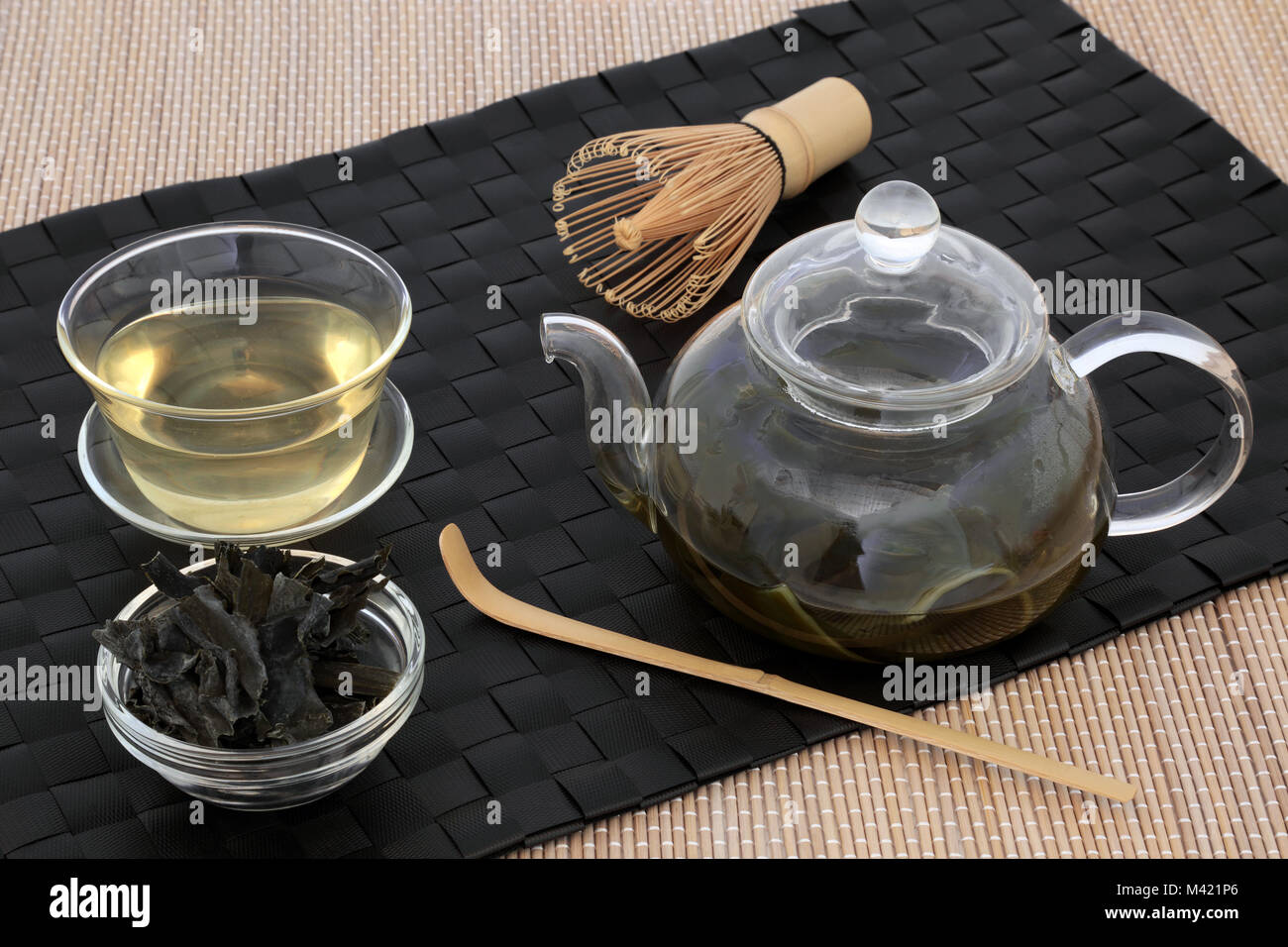 Japanese sencha wakame seaweed tea with glass teapot and cup, dried ...