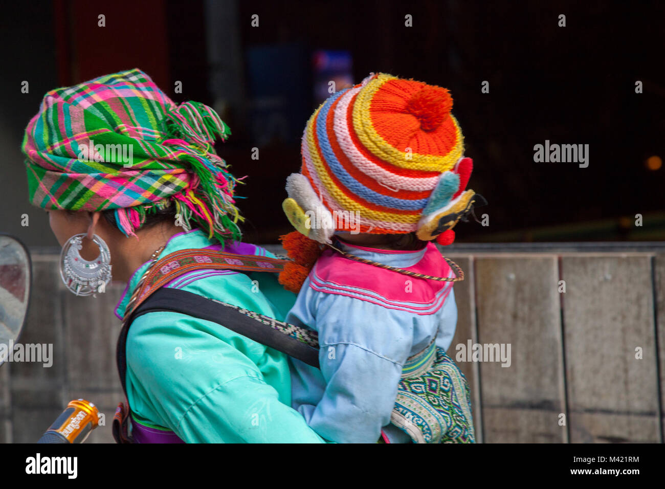 woman with child on back of the Hmong tribe in Sapa Vietnam Stock Photo ...