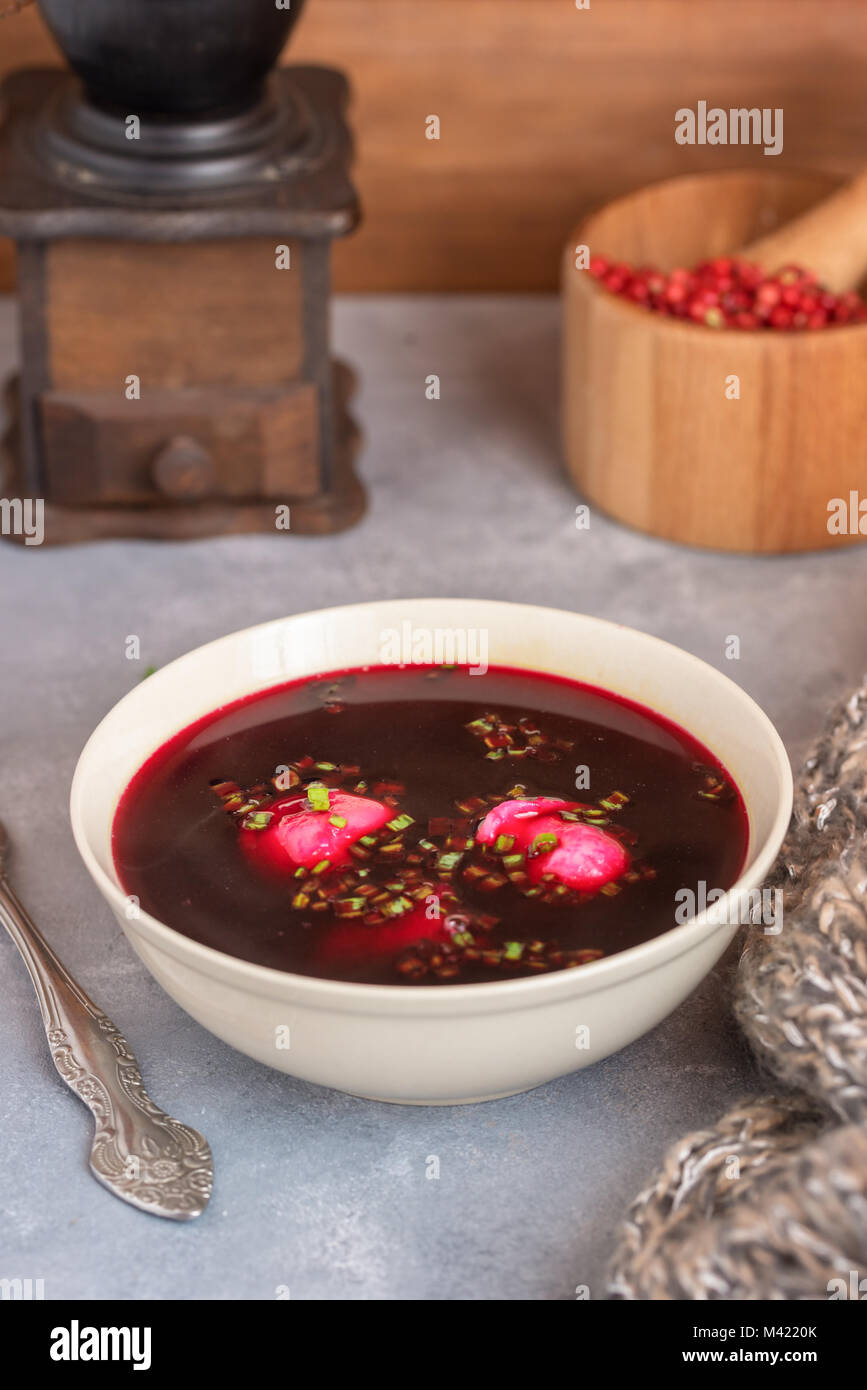 Traditional polish clear red borscht with dumplings Stock Photo - Alamy