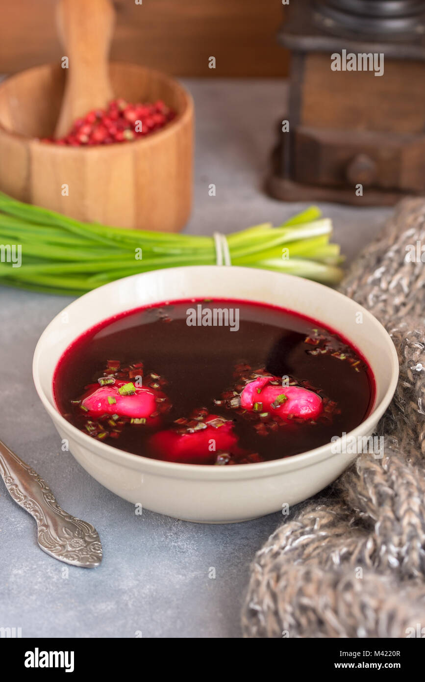 Traditional polish clear red borscht with dumplings Stock Photo - Alamy