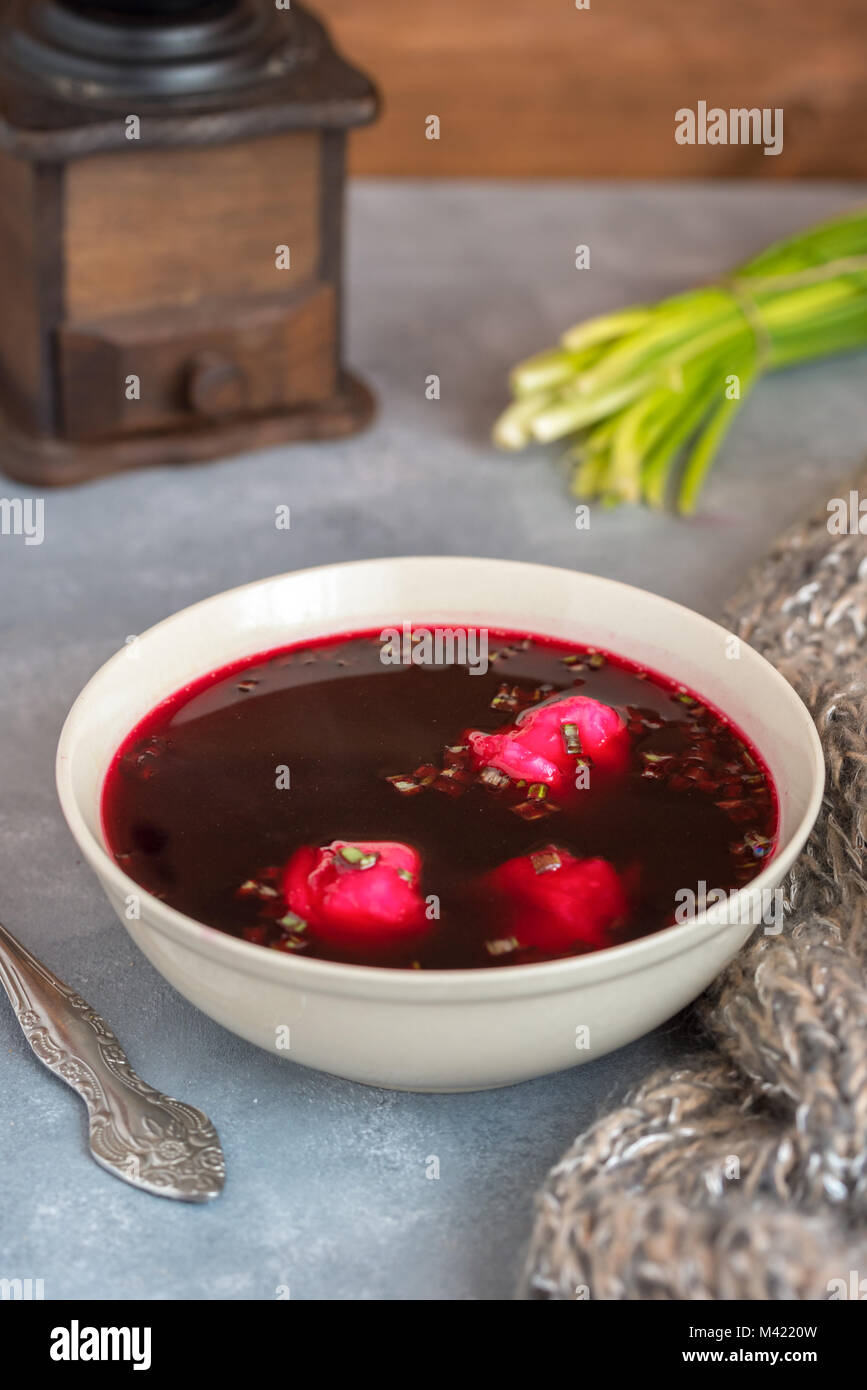 Traditional polish clear red borscht with dumplings Stock Photo - Alamy