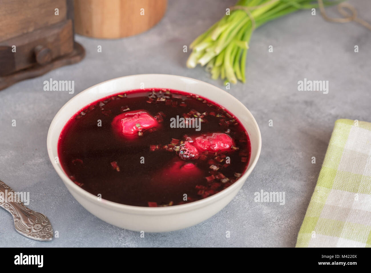 Traditional polish clear red borscht with dumplings Stock Photo - Alamy