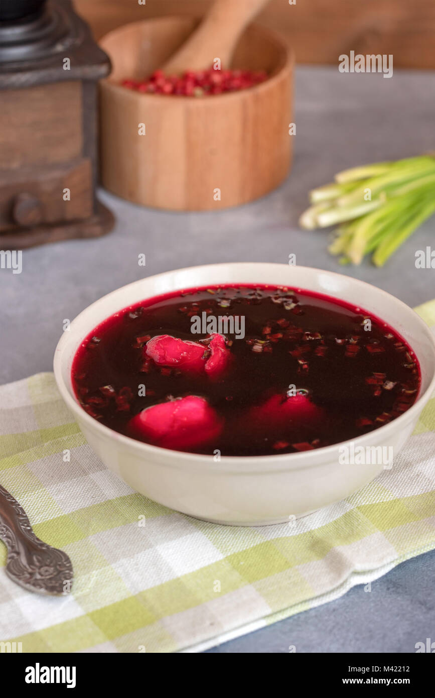 Traditional polish clear red borscht with dumplings Stock Photo - Alamy