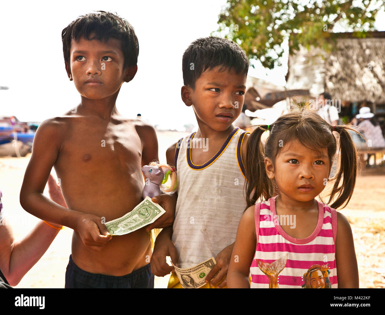 SIEM REAP, CAMBODIA-NOV 22, 2013: Cambodian people live beside Tonle ...