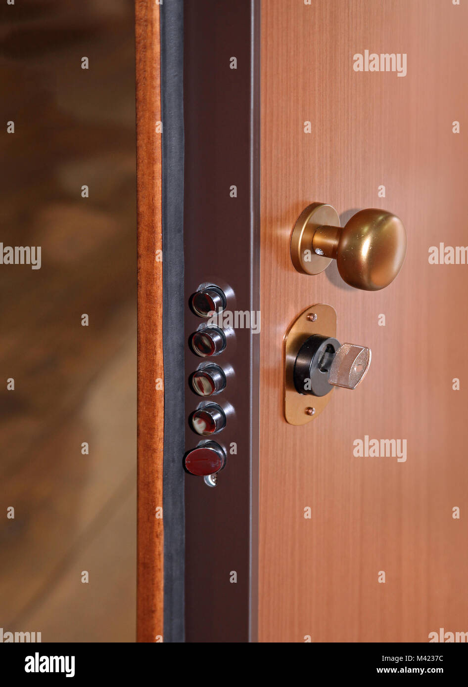Key in lock of classic home entry door Stock Photo - Alamy