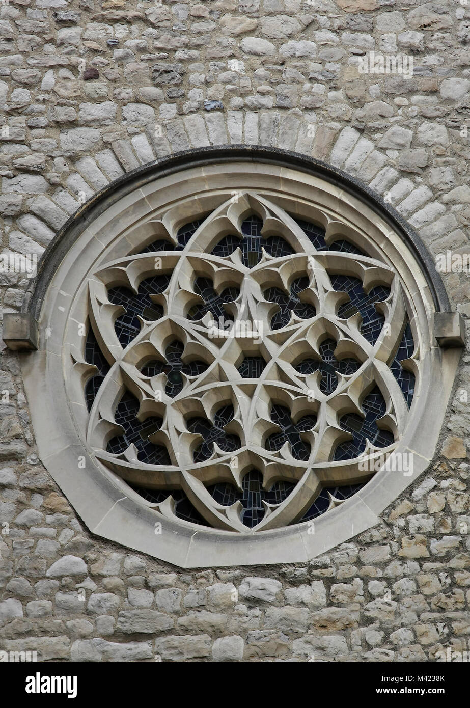 Oval window exterior on old church with stone facade Stock Photo - Alamy