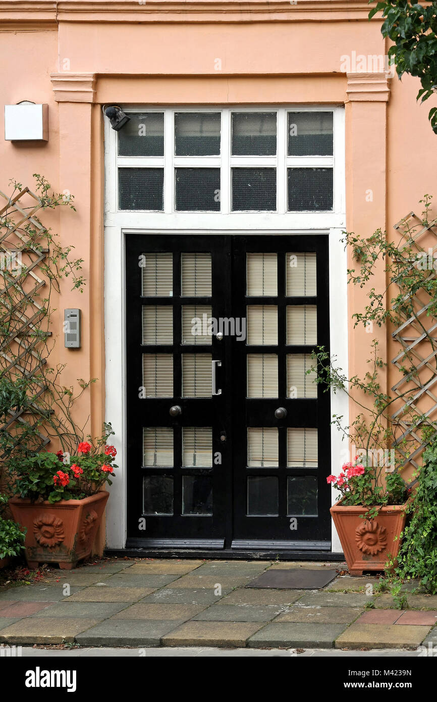 Retro entrance door in front of residential house Stock Photo - Alamy