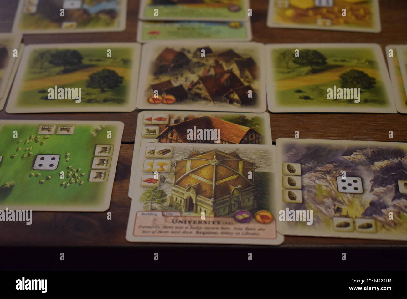 Settlers of Catan Cards in a stack Stock Photo - Alamy