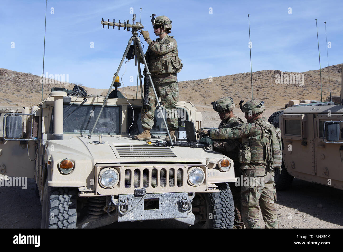 FORT IRWIN, Calif. – Sgt. Camille Coffey (on the antenna), Spc ...