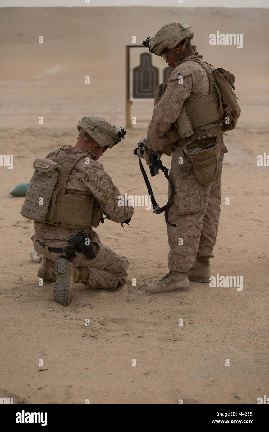 U.S Marine Staff Sgt. Travis Romesko (kneeling), Headquarters and ...