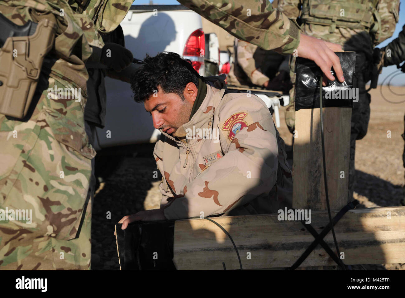 British army engineers and a 38th Brigade, Iraqi army, student prepare ...