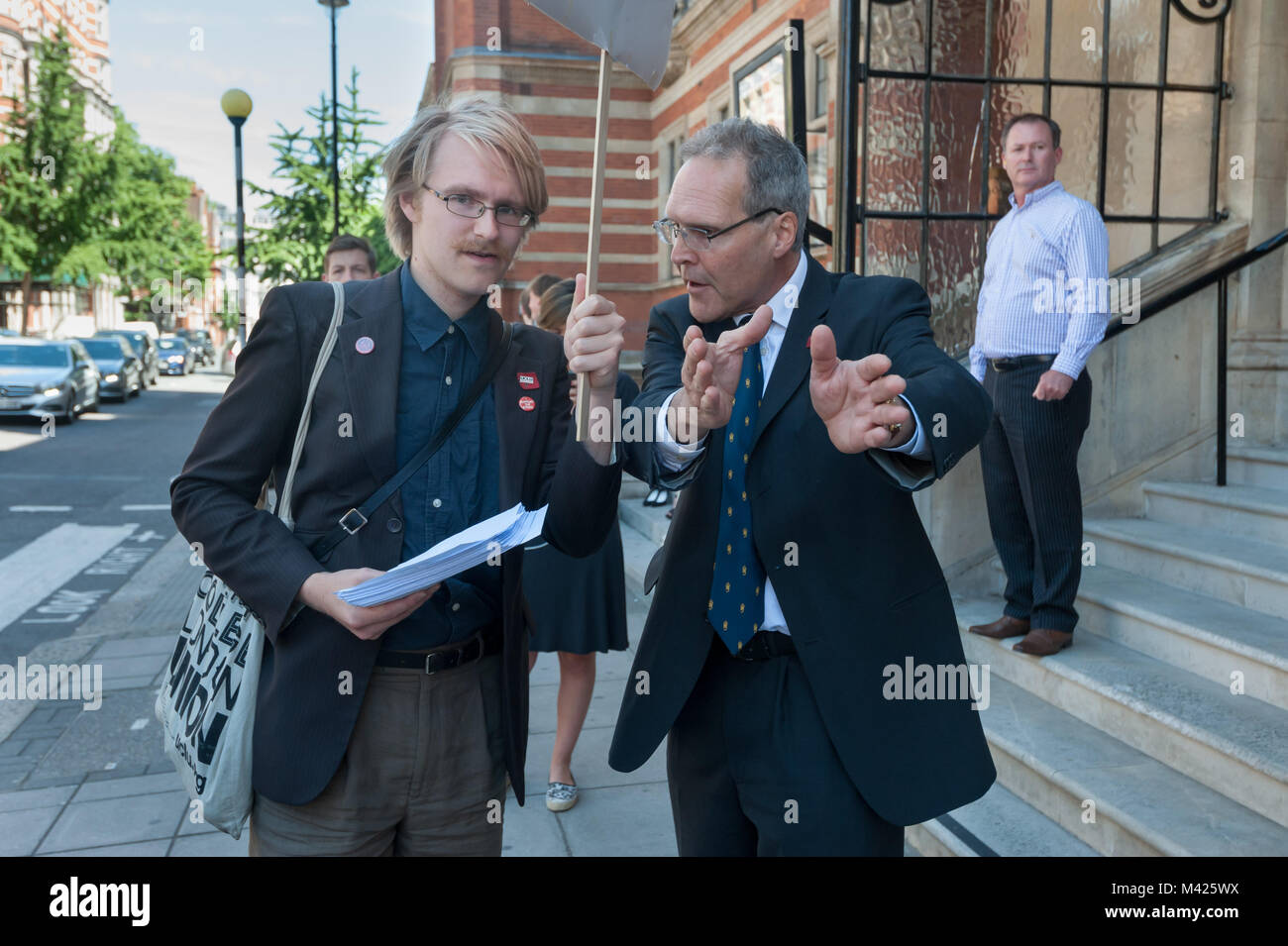 Giving leaflets college hi-res stock photography and images - Alamy