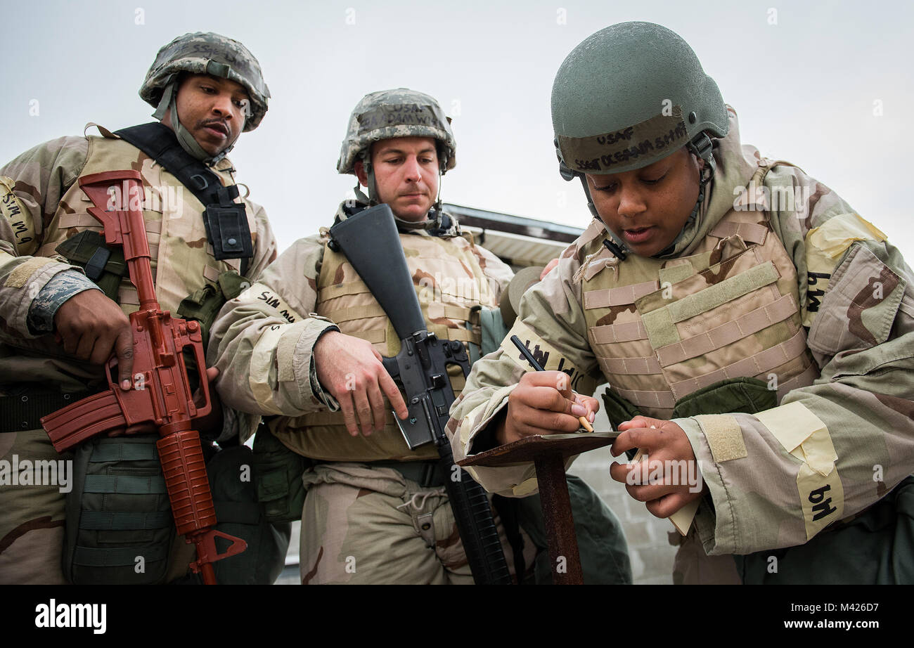 A staff sergeant marks the date on new M8 chemical detection paper ...