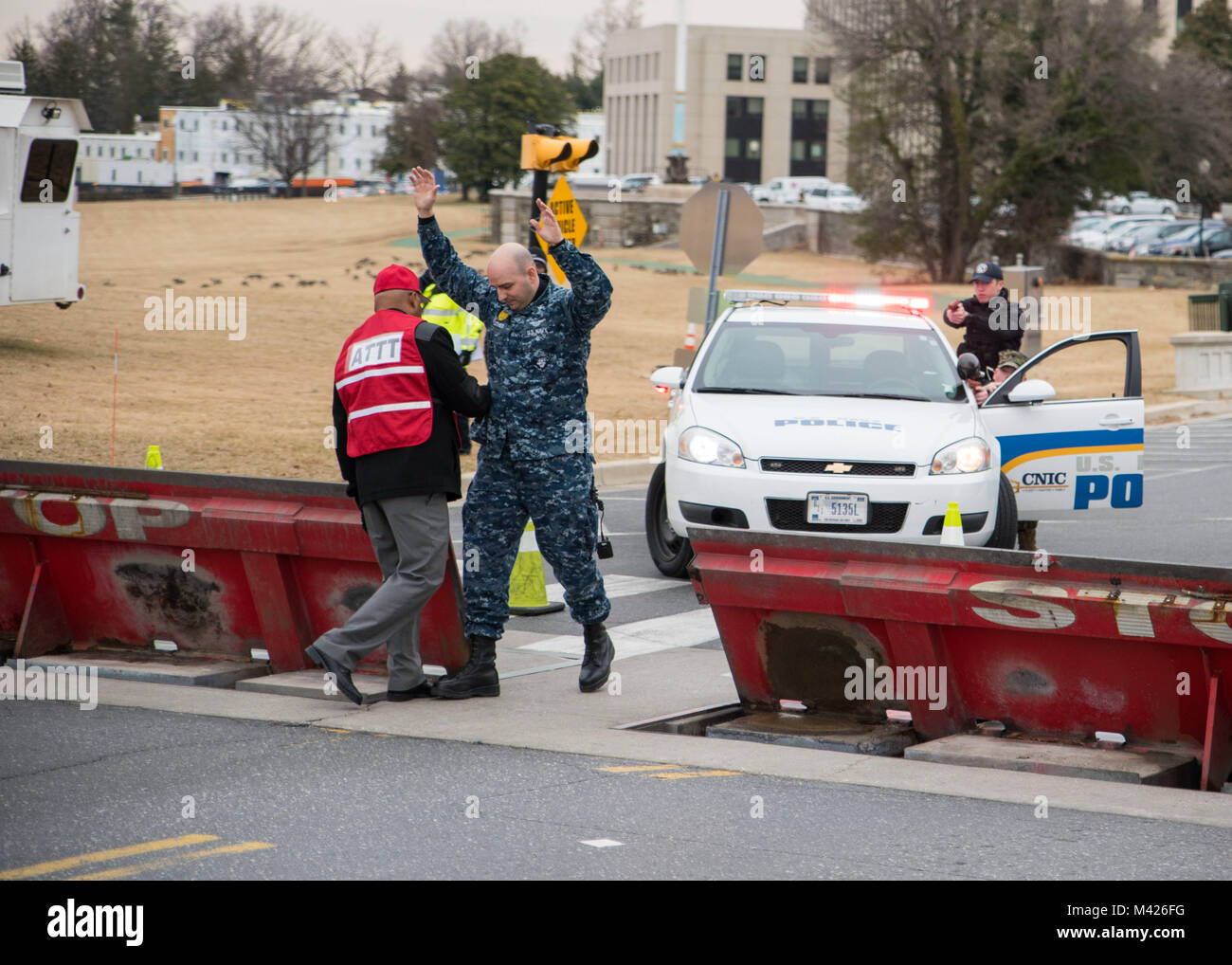 Sailors instruct a gate runner to walk backward during gate runner ...