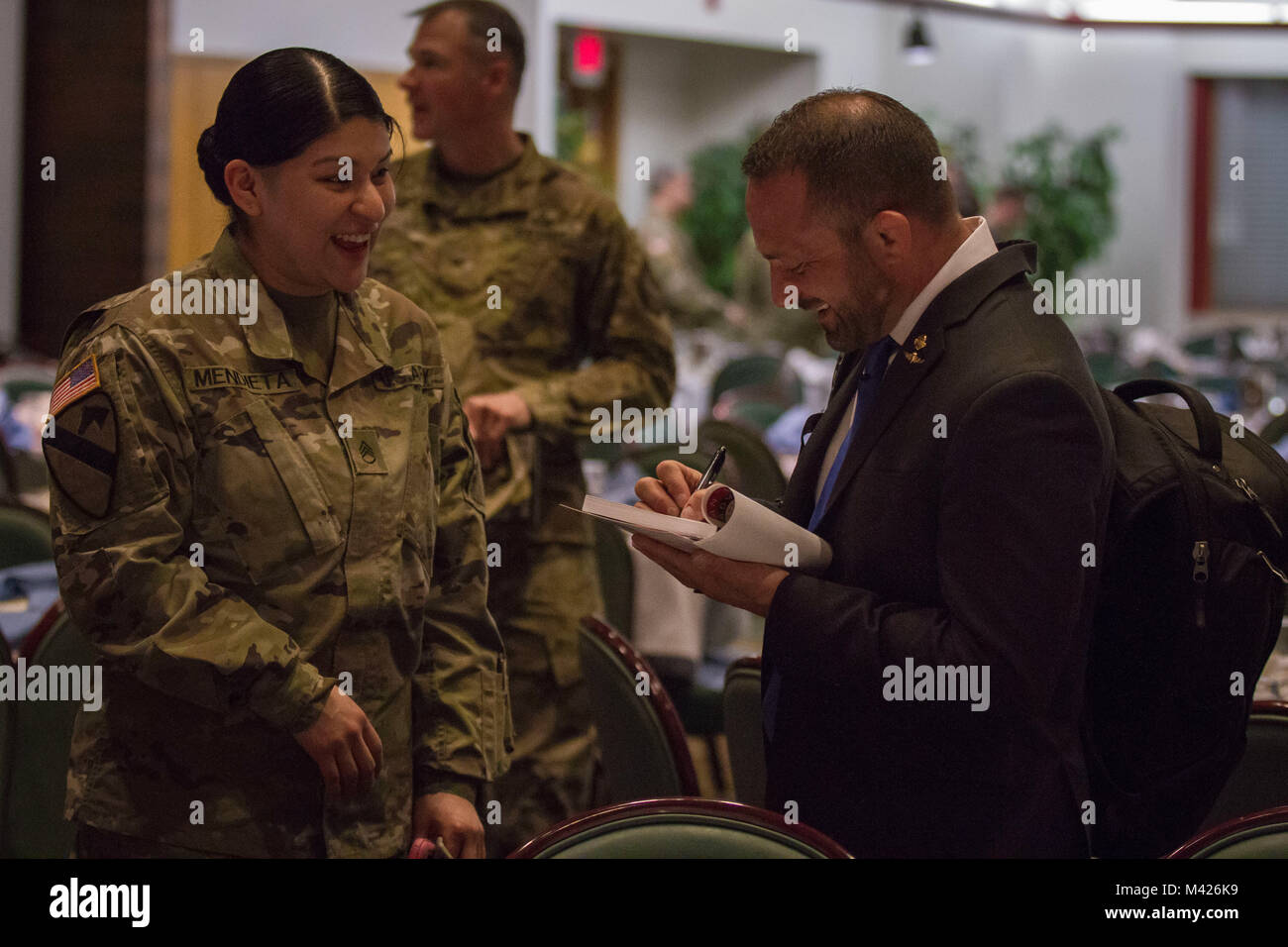 Guest speaker Chad Robichaux greets a Soldier after the conclusion of ...