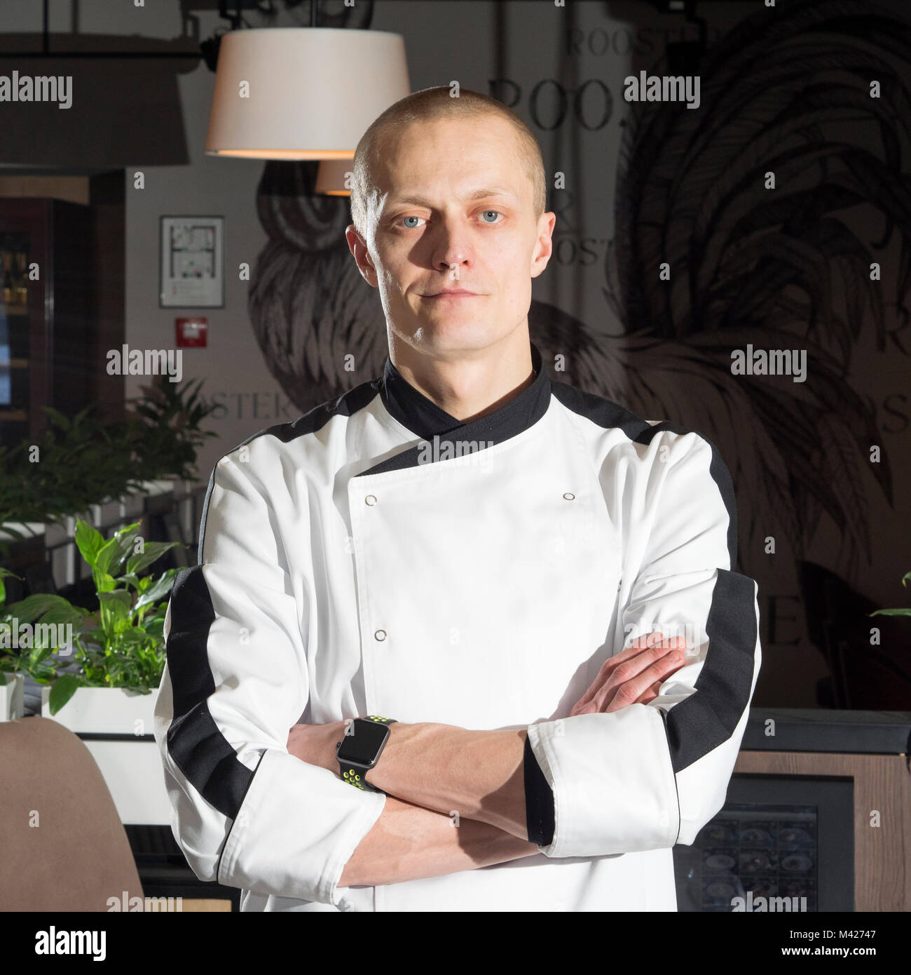 portrait of chef standing with knife in the restaurant Stock Photo - Alamy