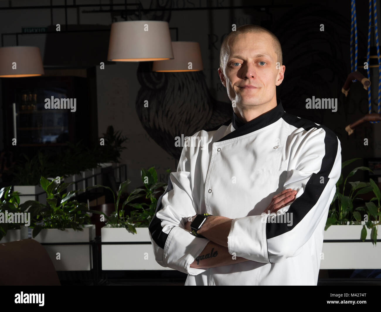 portrait of chef standing with knife in the restaurant Stock Photo - Alamy
