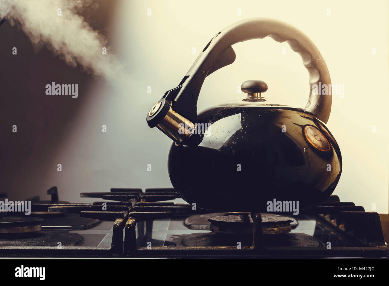 Old kettle on gas stove hi-res stock photography and images - Alamy