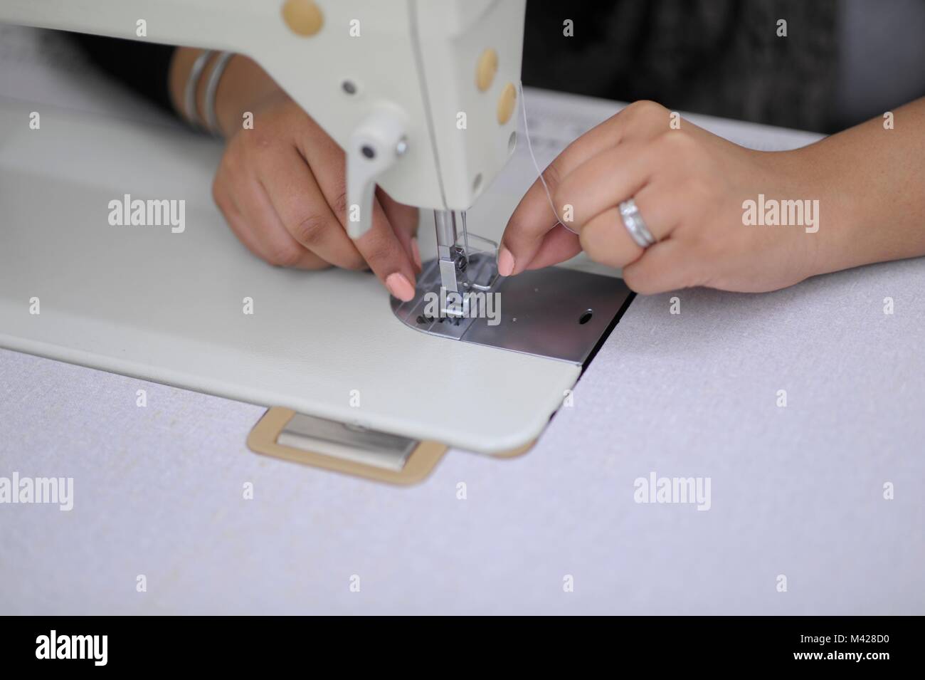 Womans hands on sewing machine hi-res stock photography and images - Alamy