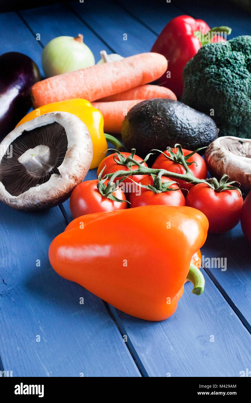A harvest of freshly gathered organic vegetables ready for cooking ...