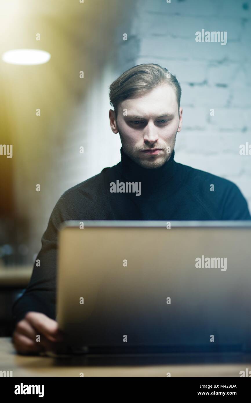 Young man with a laptop Stock Photo - Alamy