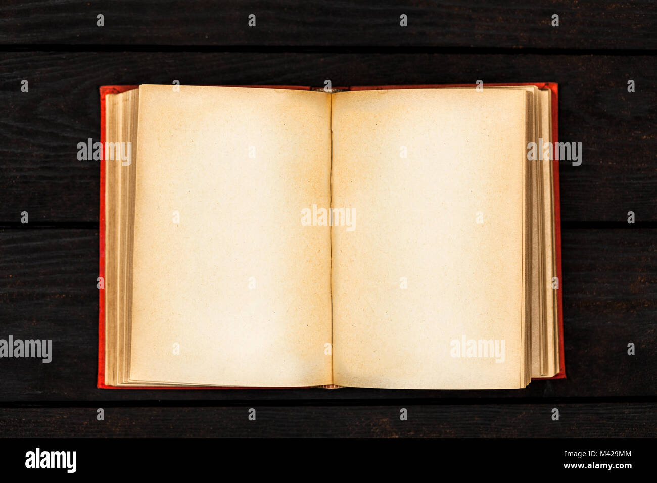 Open book on dark background Stock Photo - Alamy