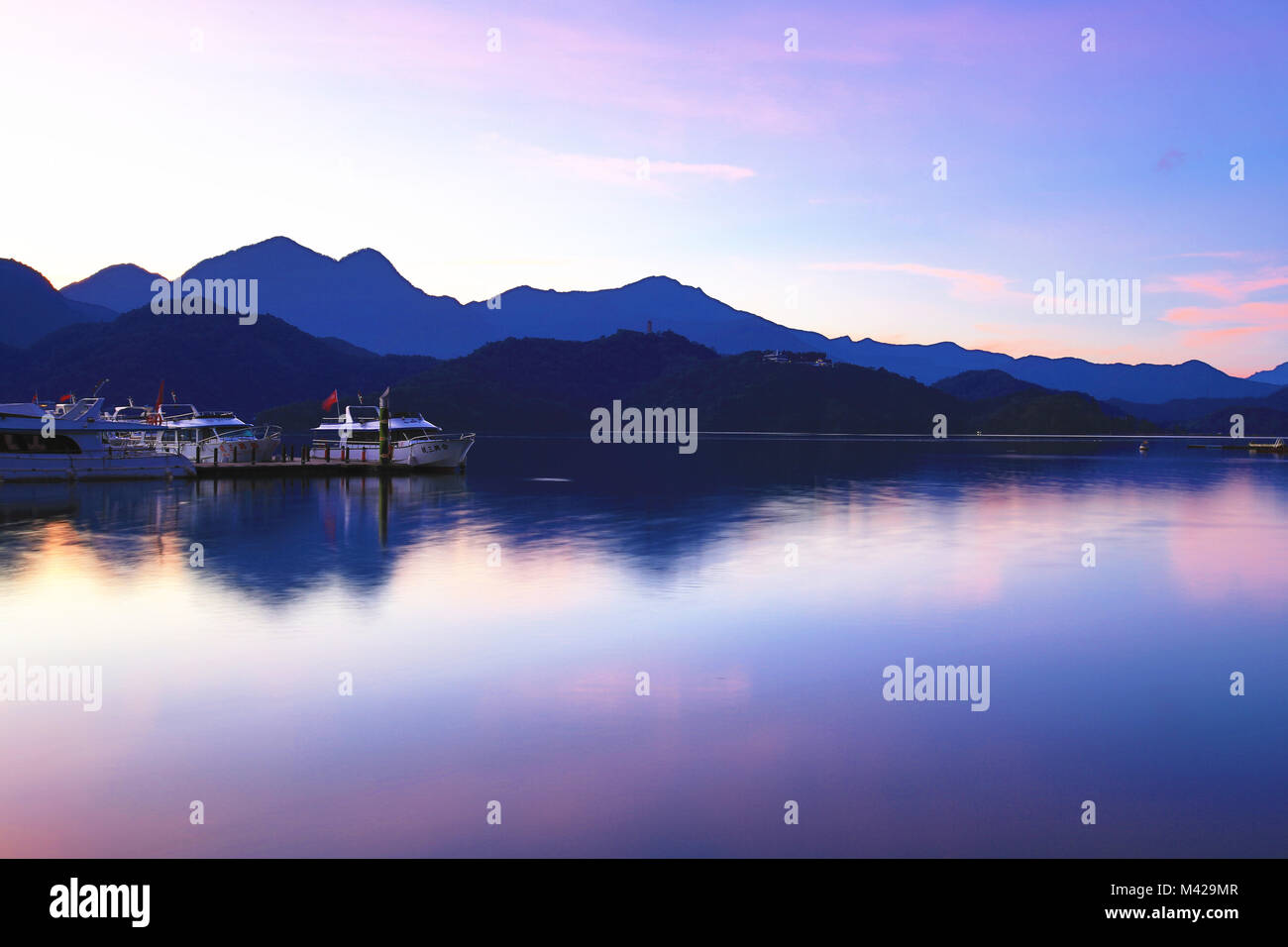 Beautiful dawn landscape with mountains,lake and reflection Stock Photo ...