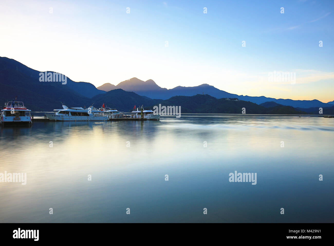 Beautiful dawn landscape with mountains,lake and reflection Stock Photo ...