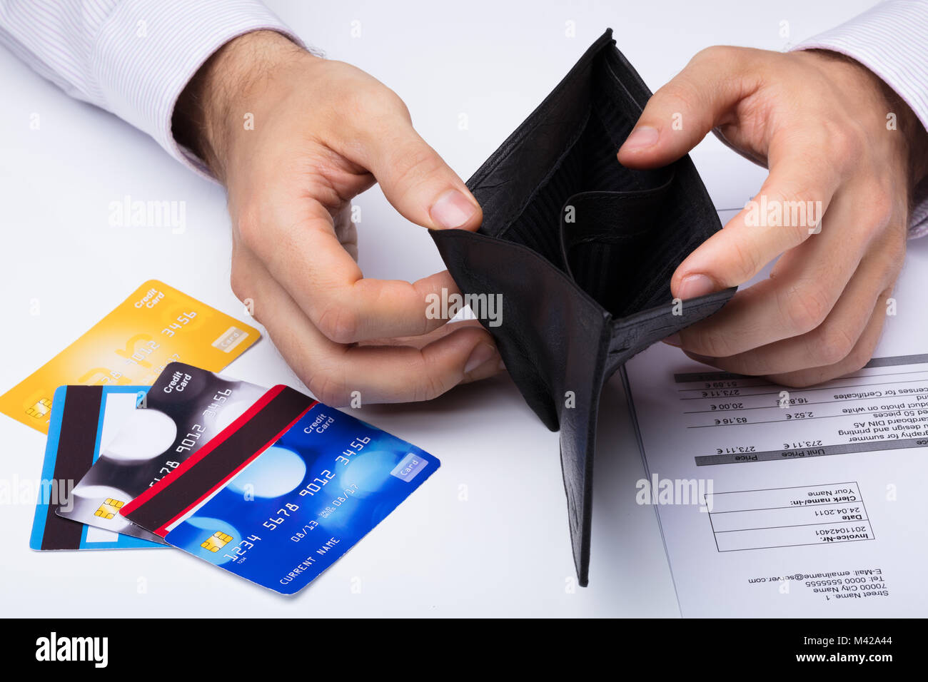 Close-up Of Person Showing Empty Wallet With Credit Card On Desk Stock ...