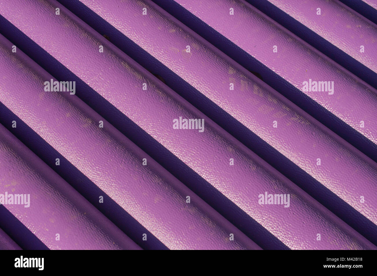 background formed by lilac pvc tubes with rough testura Stock Photo - Alamy