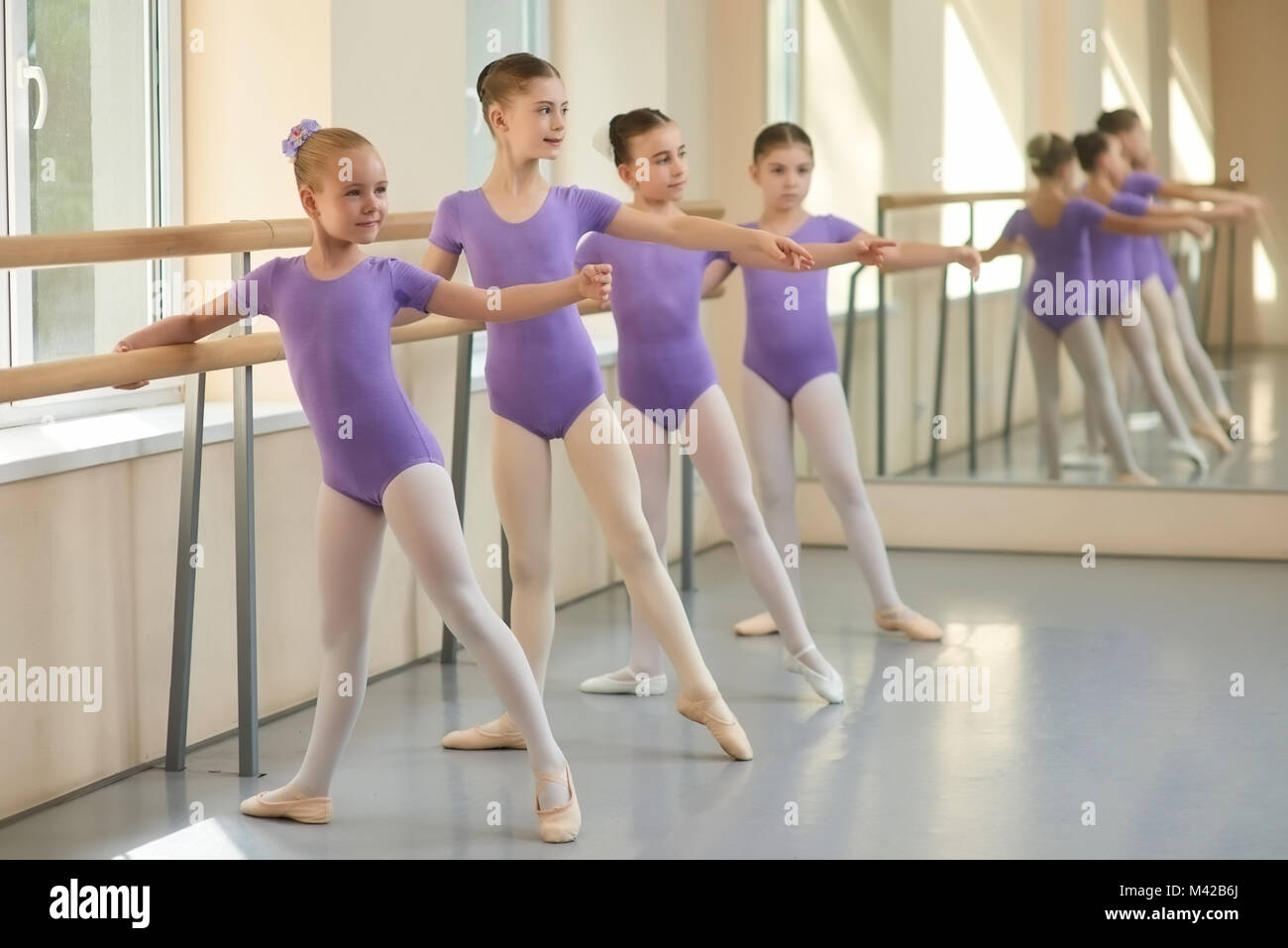Young ballerinas having rehearsal at ballet school. Pretty young ballet ...