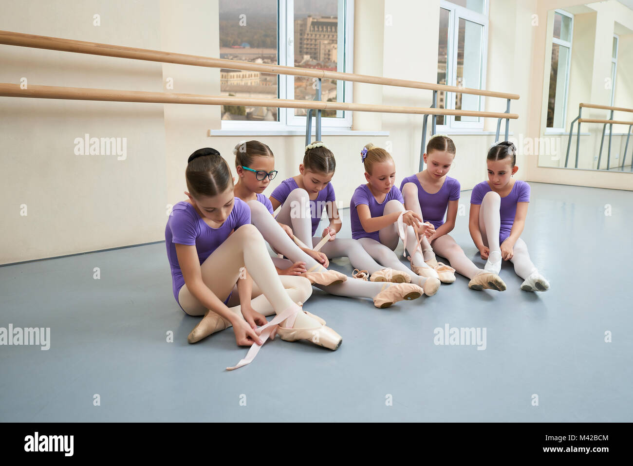 Group of young ballerinas at ballet class. Beatiful ballet dancers ...