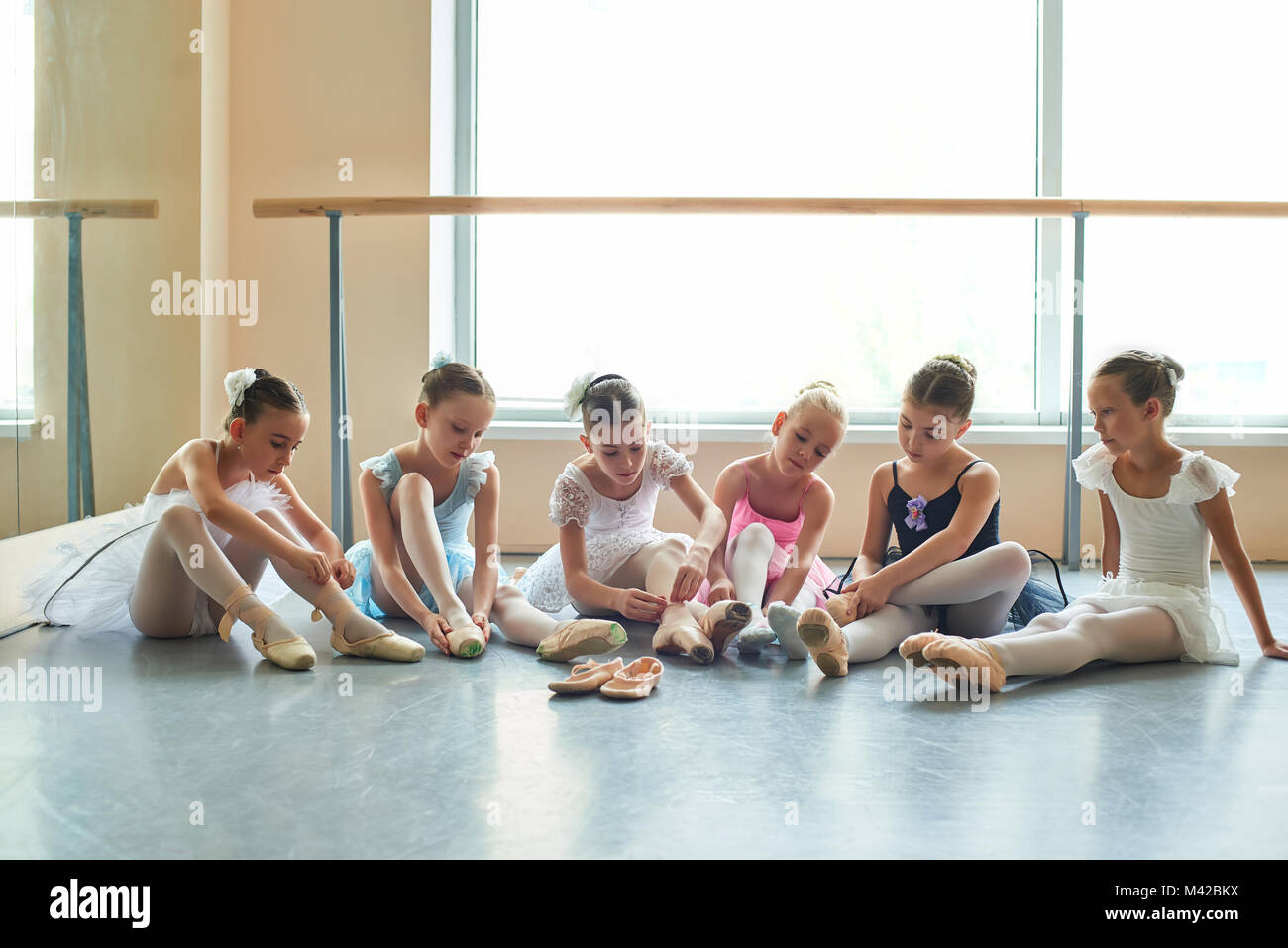 Girl putting on shoes school hi-res stock photography and images - Alamy