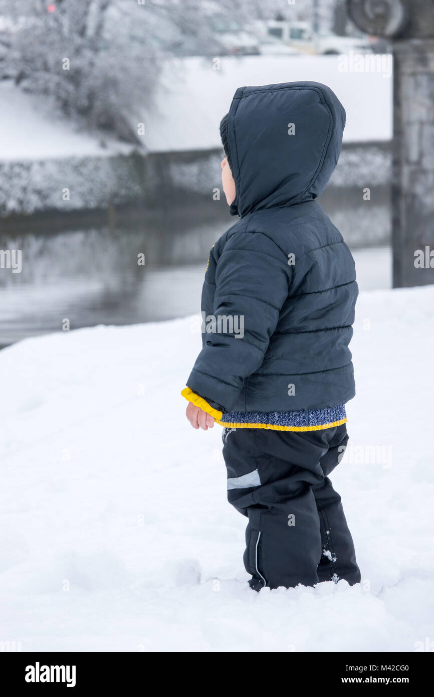 Child exploring winter Stock Photo - Alamy