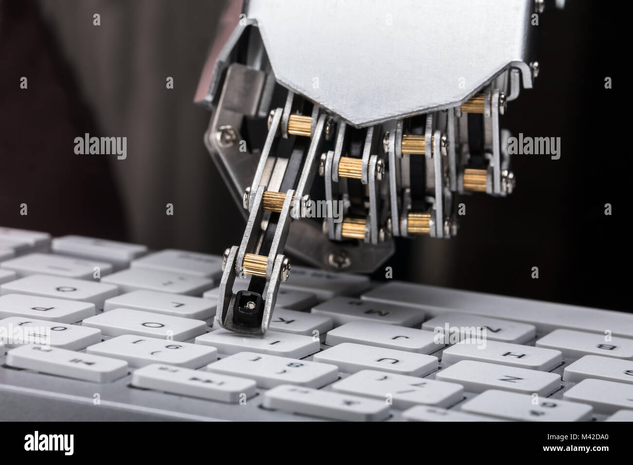 Robot typing on computer keyboard hi-res stock photography and images ...