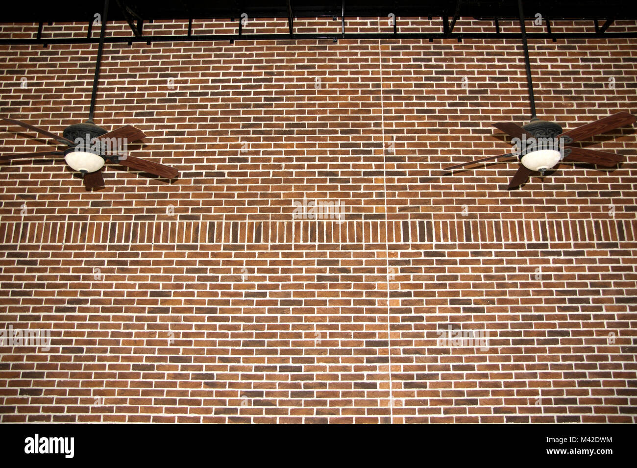 Brick wall and ceiling fan background Stock Photo - Alamy