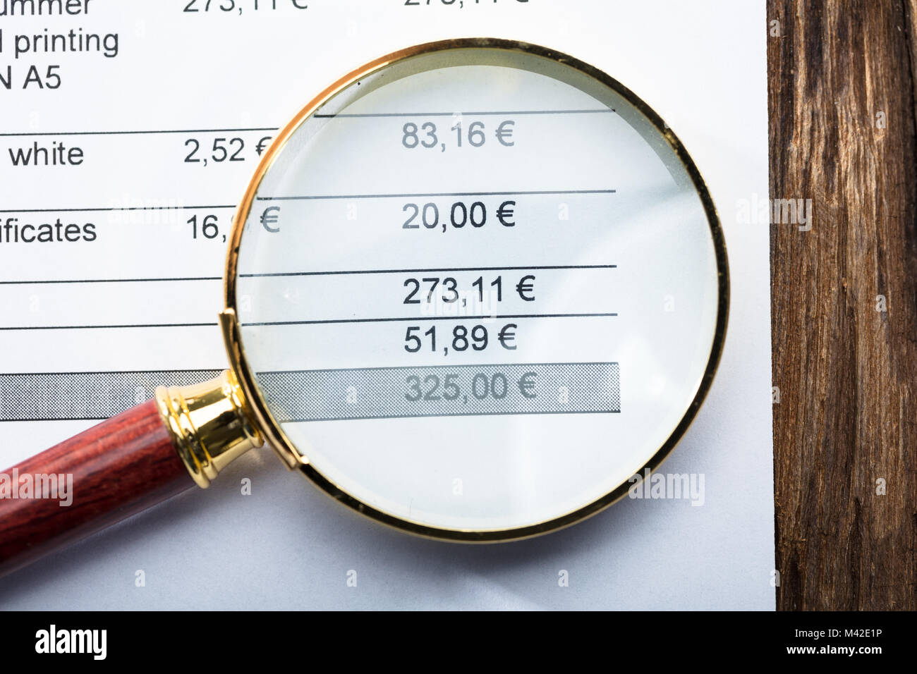 Close-up Of An Invoice Text Seen Through Magnifying Glass Stock Photo ...